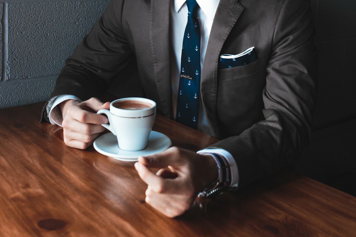 Free Photo: Man in a Suit Drinking Espresso