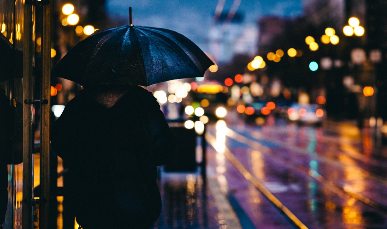 Free Photo: Person under Umbrella in the Evening City