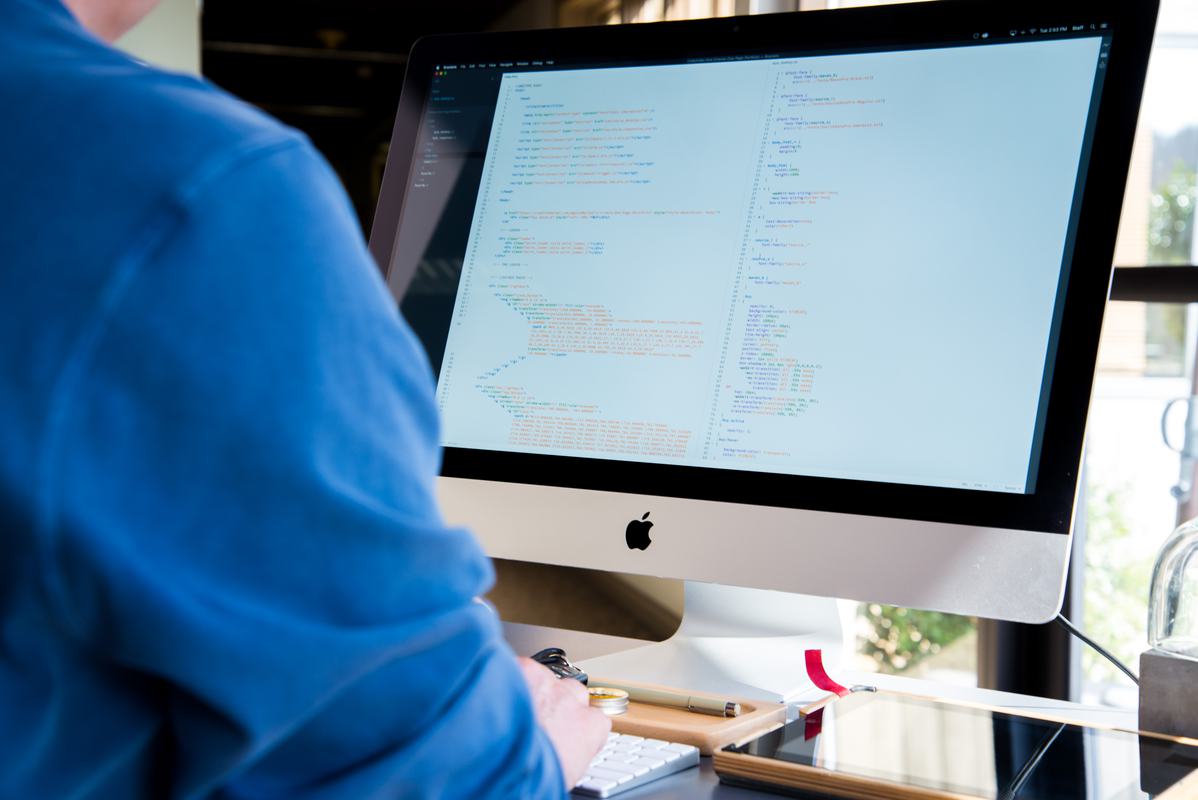 Free Photo: Programmer Working Writing Code at His iMac