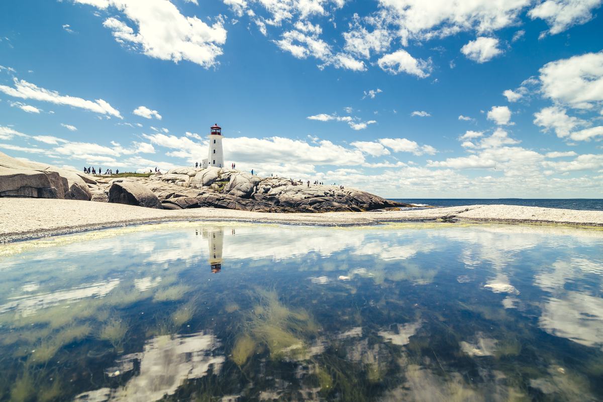 Free Photo: A Lighthouse Reflection with Calm Waters