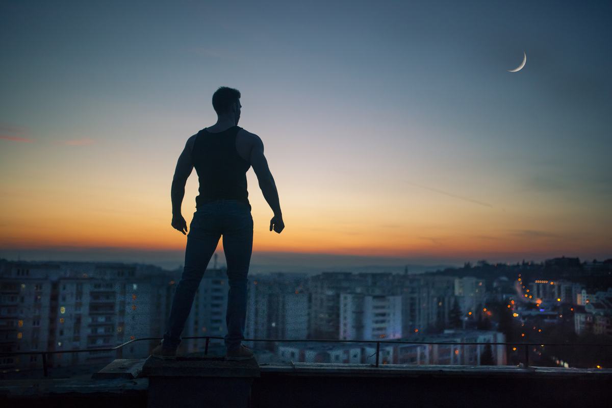 Free Photo: Brave, Young and Muscular Man Standing on the Roof Looking ...