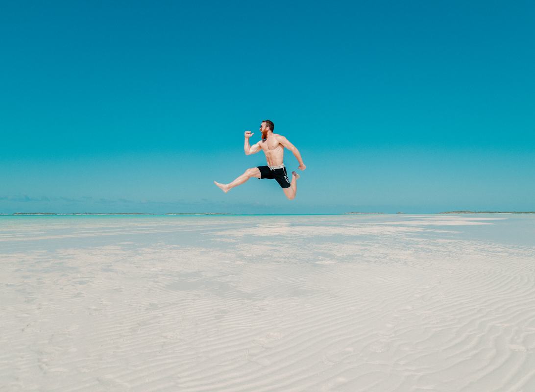 Free Photo: Happy Man Jumping on the Beach
