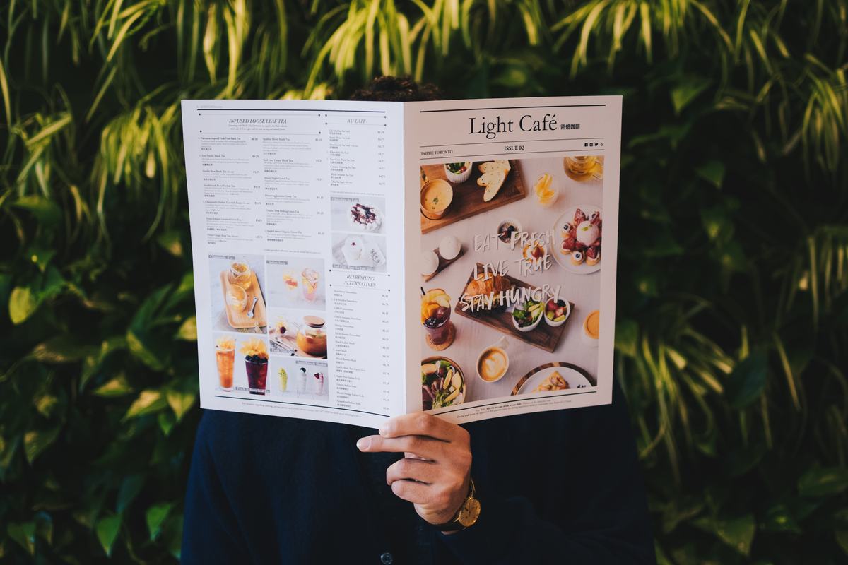 Free Photo: Man Keeps the Menu to Make an Order at the Cafe