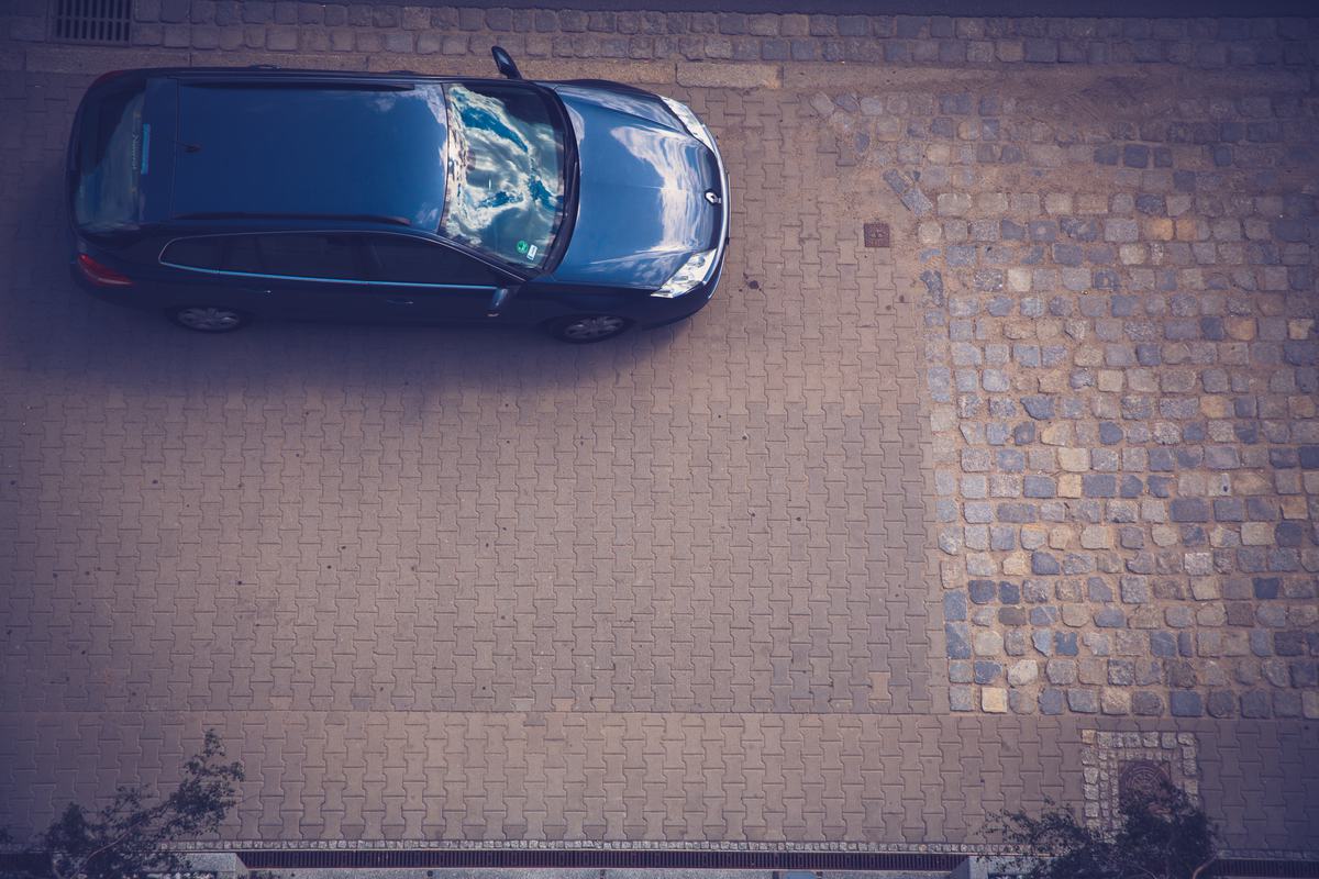 Free Photo: Car Parked on the Sidewalk View from Above