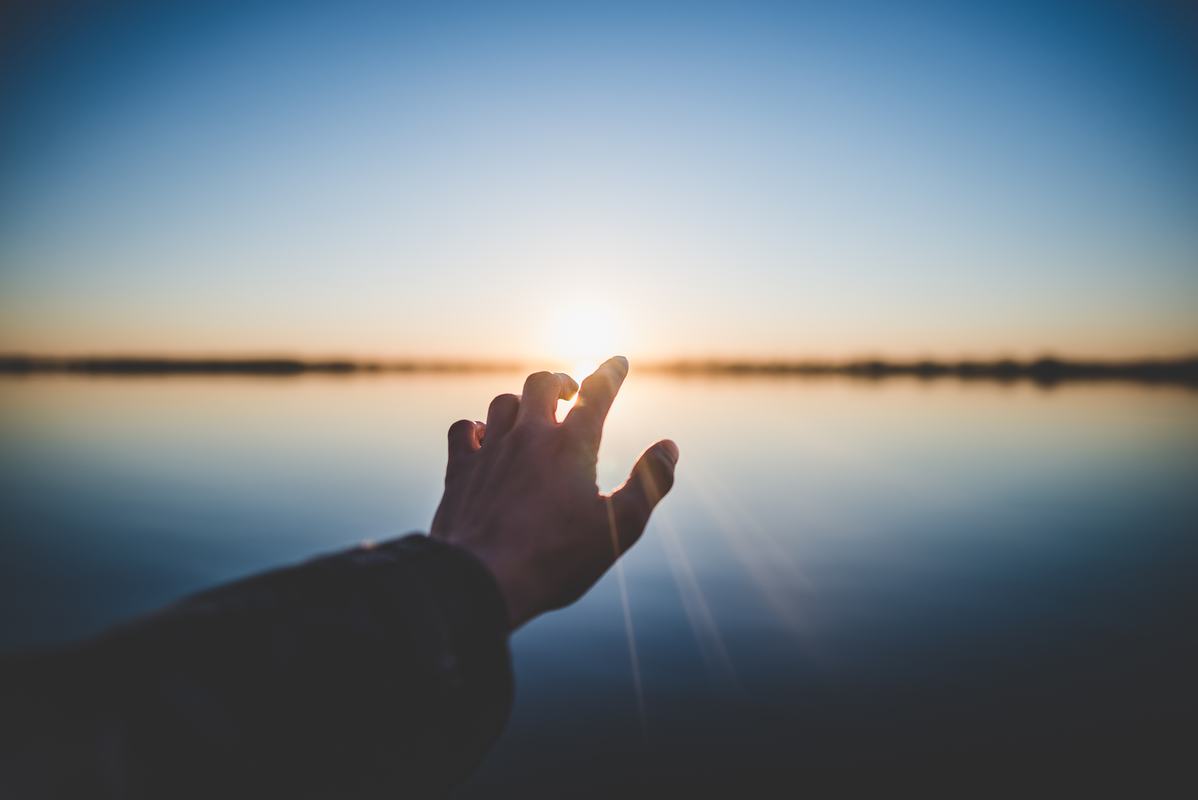 Free Photo: Hand Touching the Sun on the Horizon